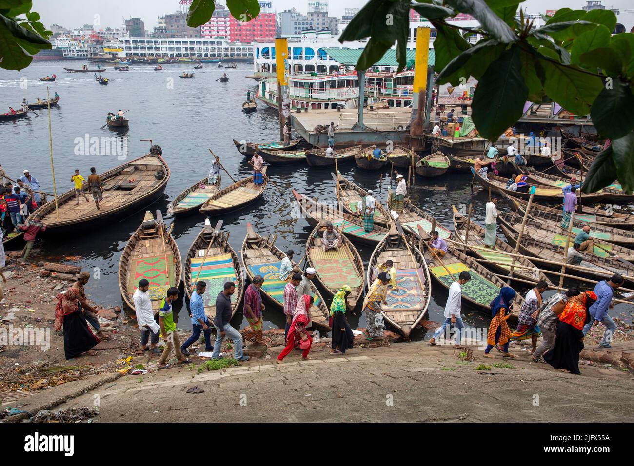 Boat anchored on the bank of Buriganga river in Old Dhaka, Bangladesh ...