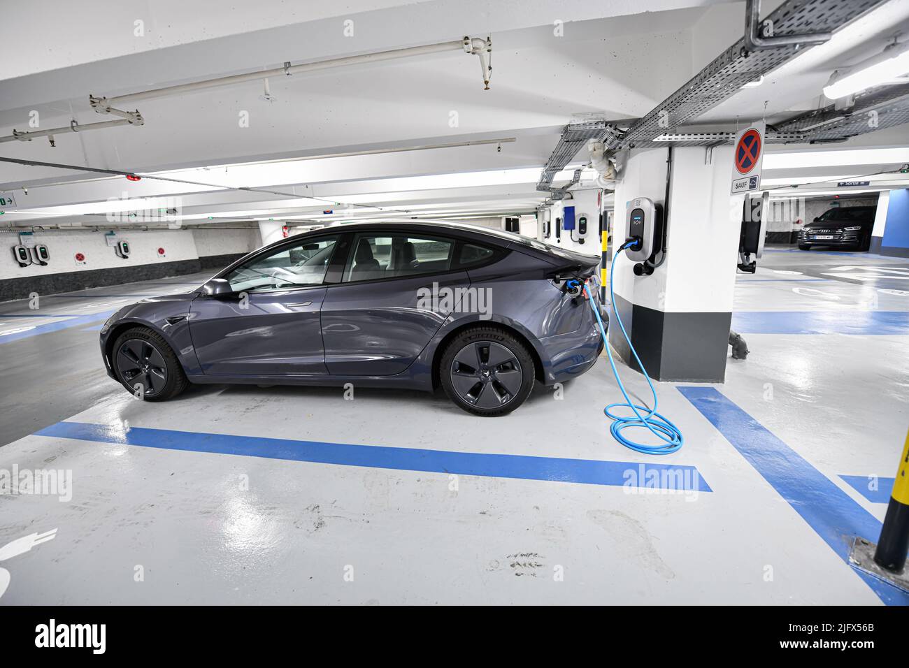 Parking under the Madeleine church, with Tesla cars plugged in to be ...
