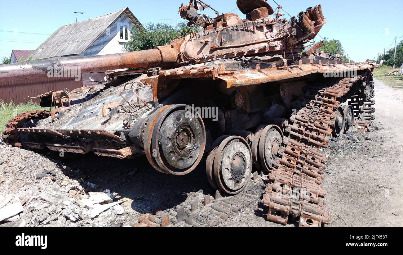 Destroyed tank on the street of the village of Ukraine Stock Photo - Alamy