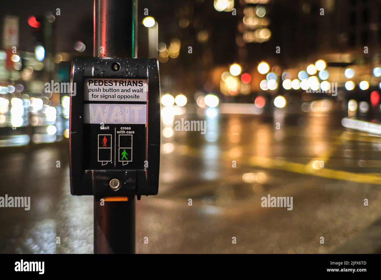 Pedestrian crossing signal at night Stock Photo - Alamy