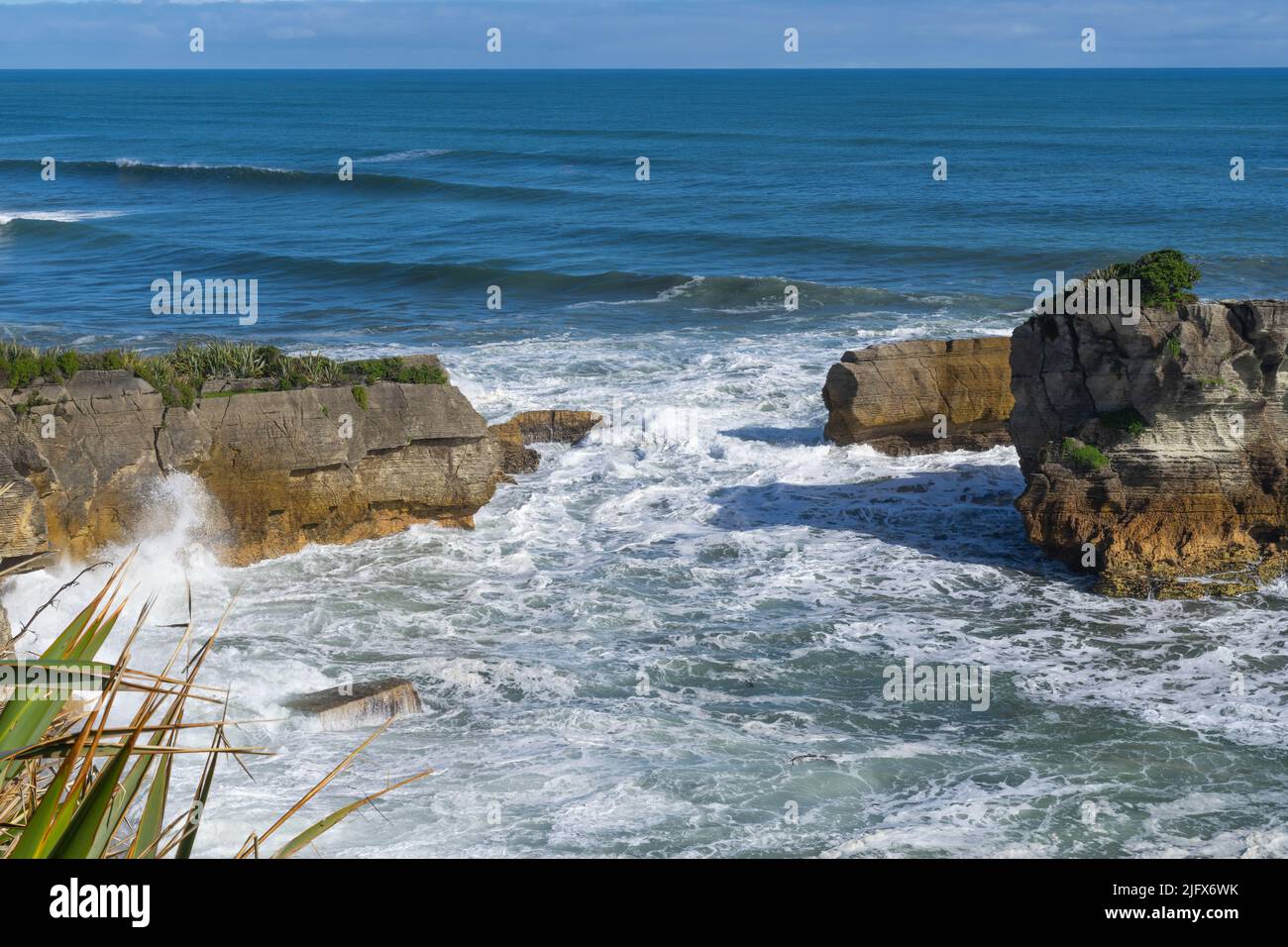 Eroded and weathered off-shore rocks of Punakaiki on West Coast of ...