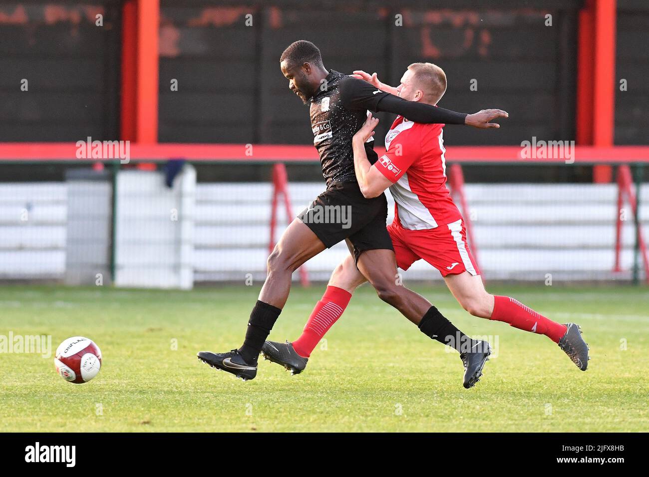 ASHTON UNDER LYNE, UK. JUL 5TH Barrow's Solomon Nwabuokei tussles with ...