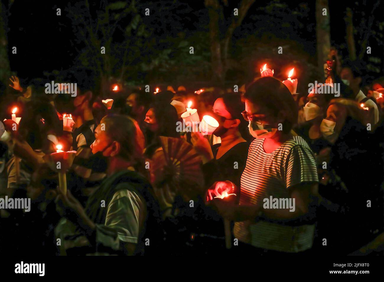 Marian devotees of Antipolo Cathedral join the solemn procession with ...