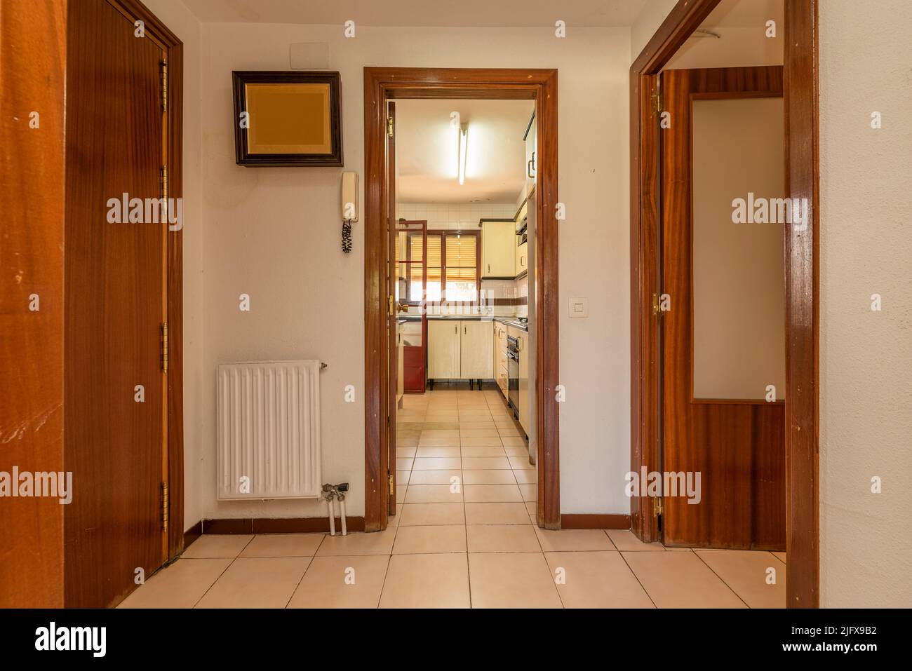 Entrance hall and distributor of a house with cream ceramic stoneware ...
