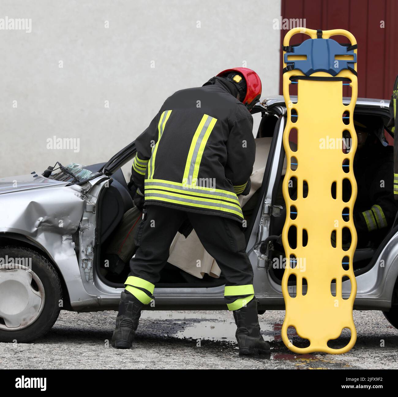 firefighters in action during the rescue of the injured after the car ...