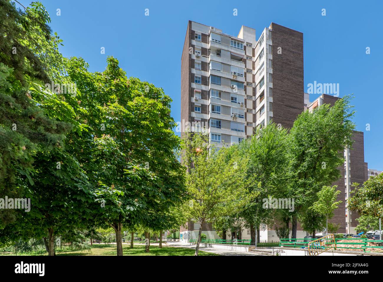 Facade of a residential building of fourteen heights surrounded by ...