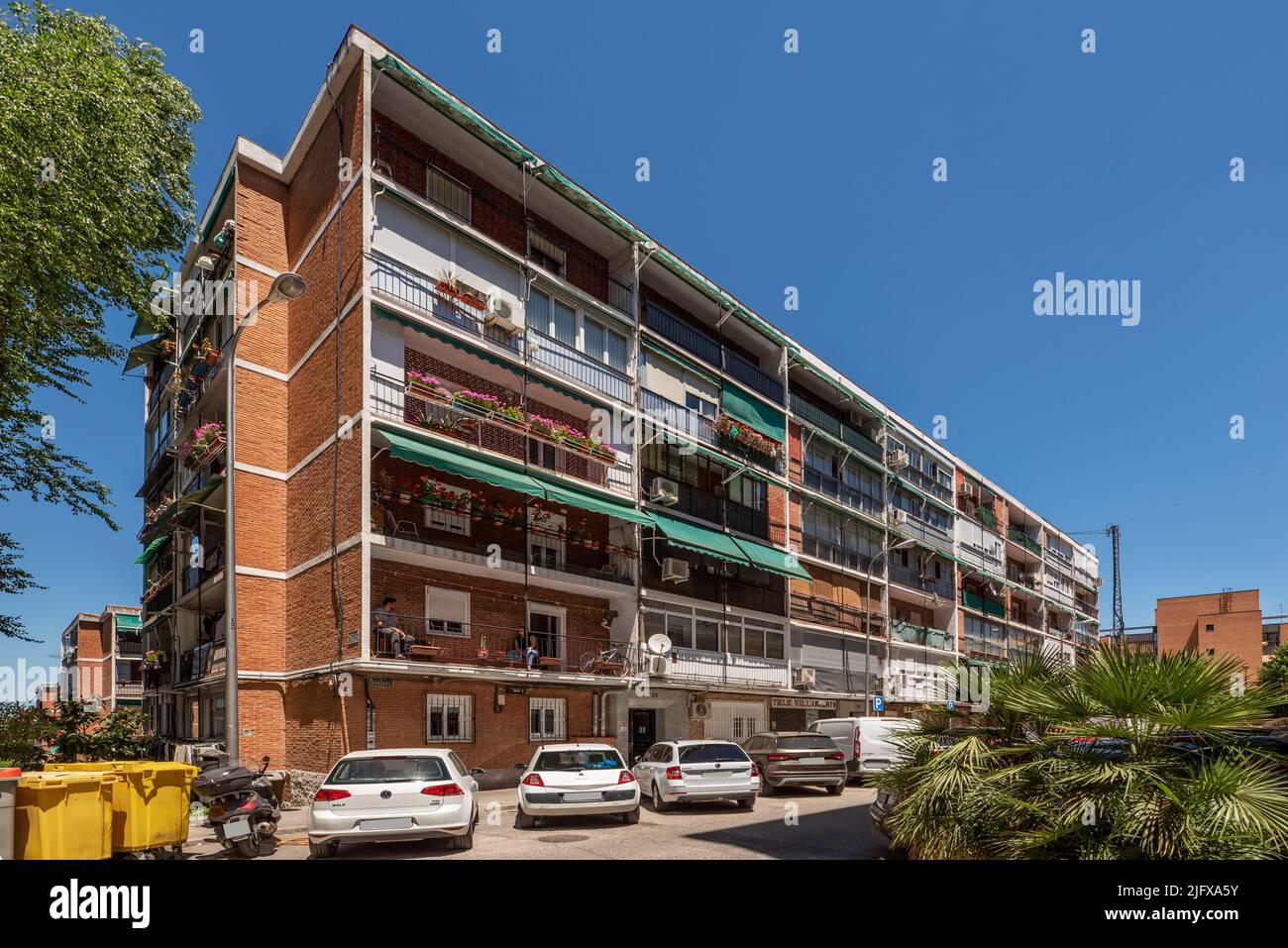 Facades of urban residential buildings with clay bricks, closed and ...