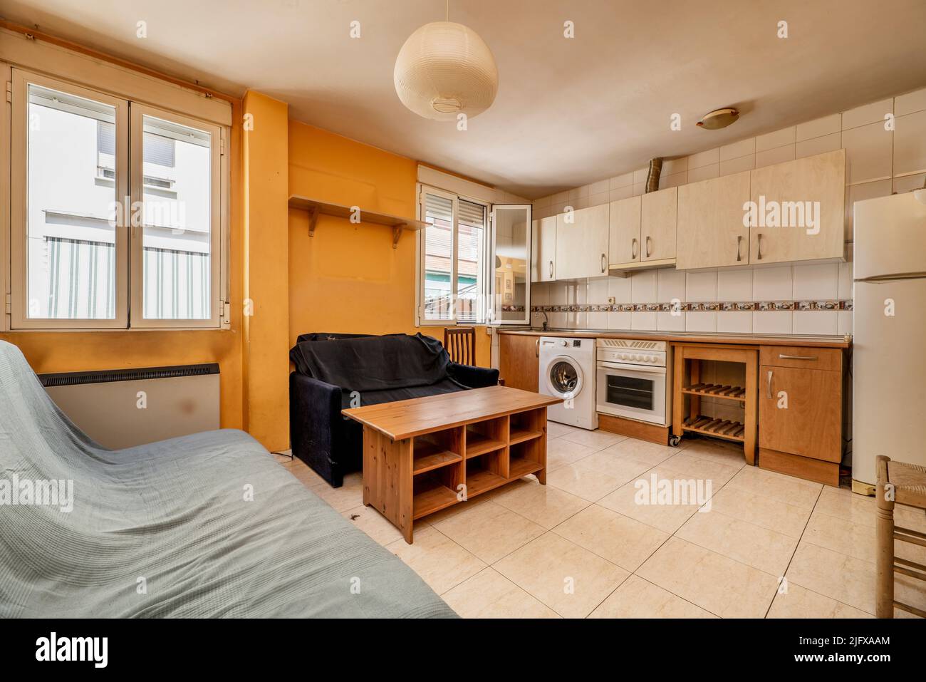 Image of kitchen front with cherry cabinets below and light cabinets ...