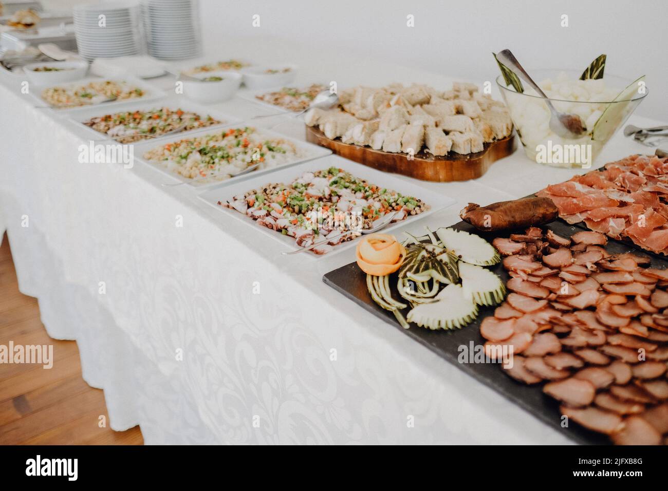 A set of different dishes and entres on an event table Stock Photo - Alamy