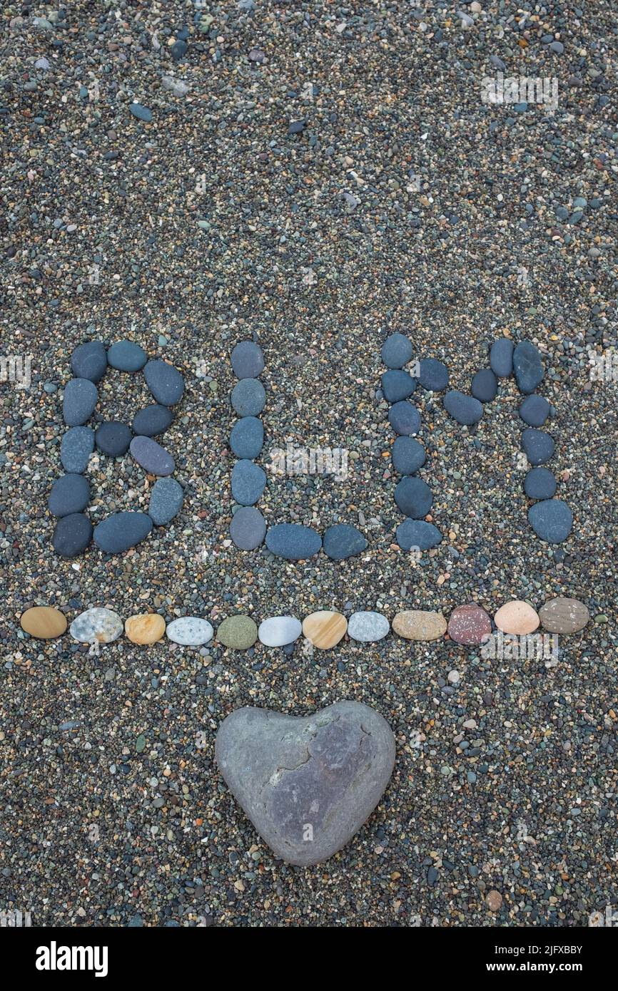 Lettering BLM Black lifes matter made from stones.. Concept of stopping ...
