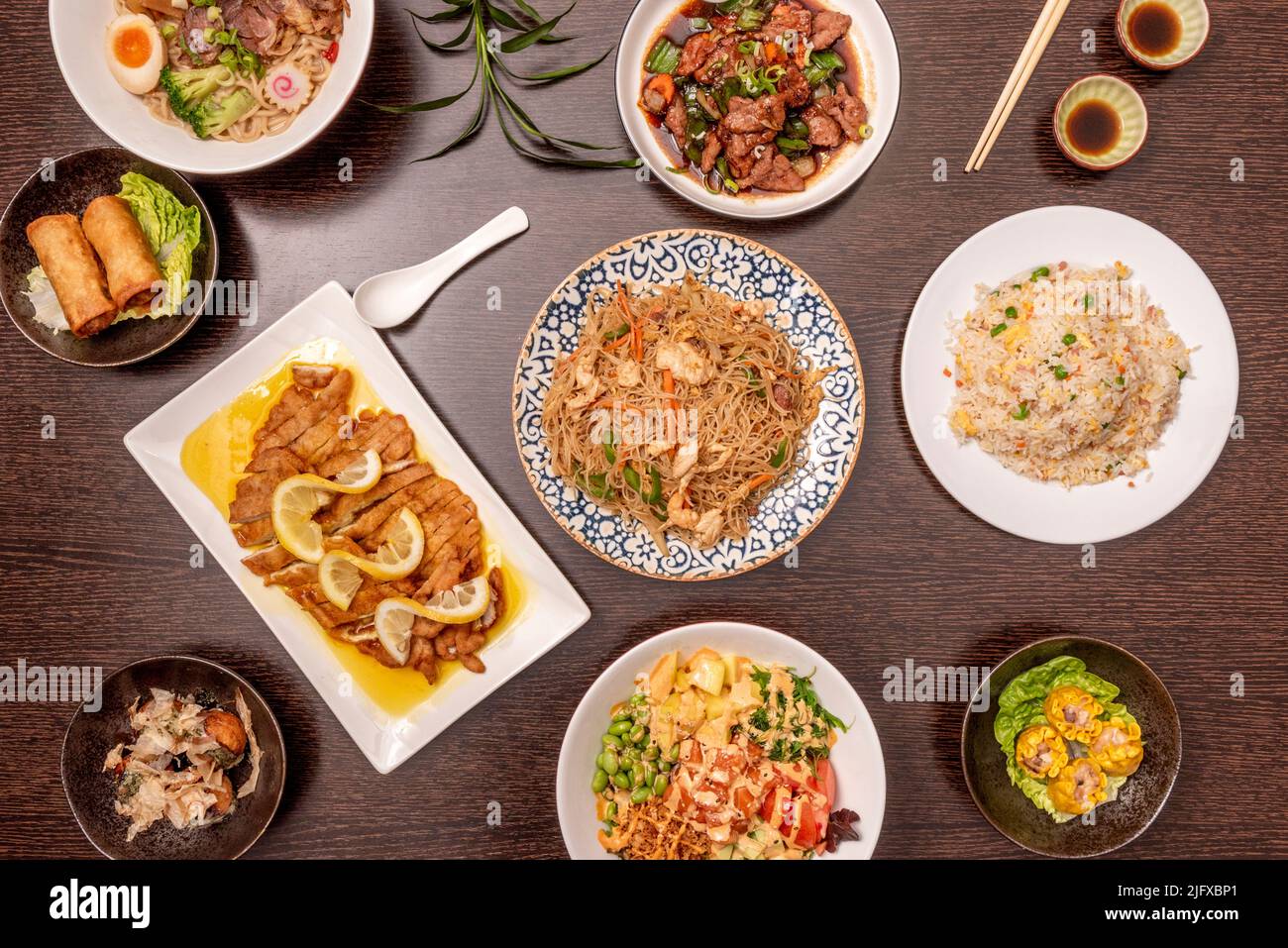 Set of asian dishes seen from above, lemon breaded chicken fillets ...