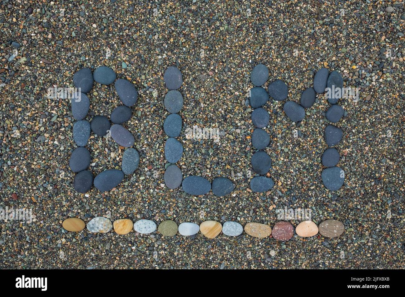 Lettering BLM Black lifes matter made from stones.. Concept of stopping ...