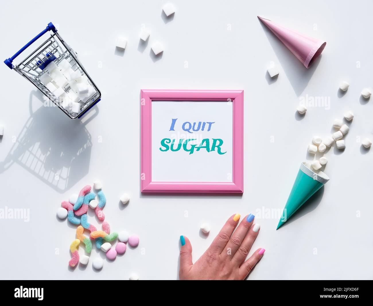 Frame with text I quit Sugar in hand. Excess of sweets, chocolate ...