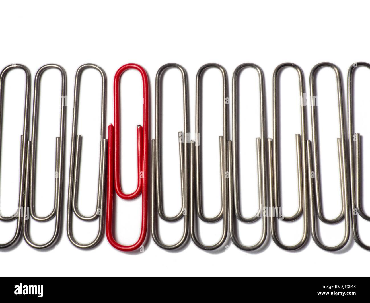 Metal paper clips on a white background. Office supplies isolate. Idea ...