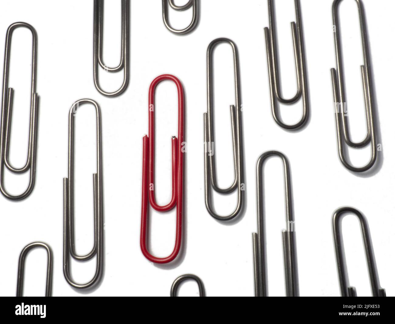 Metal paper clips on a white background. Office supplies isolate. Idea ...