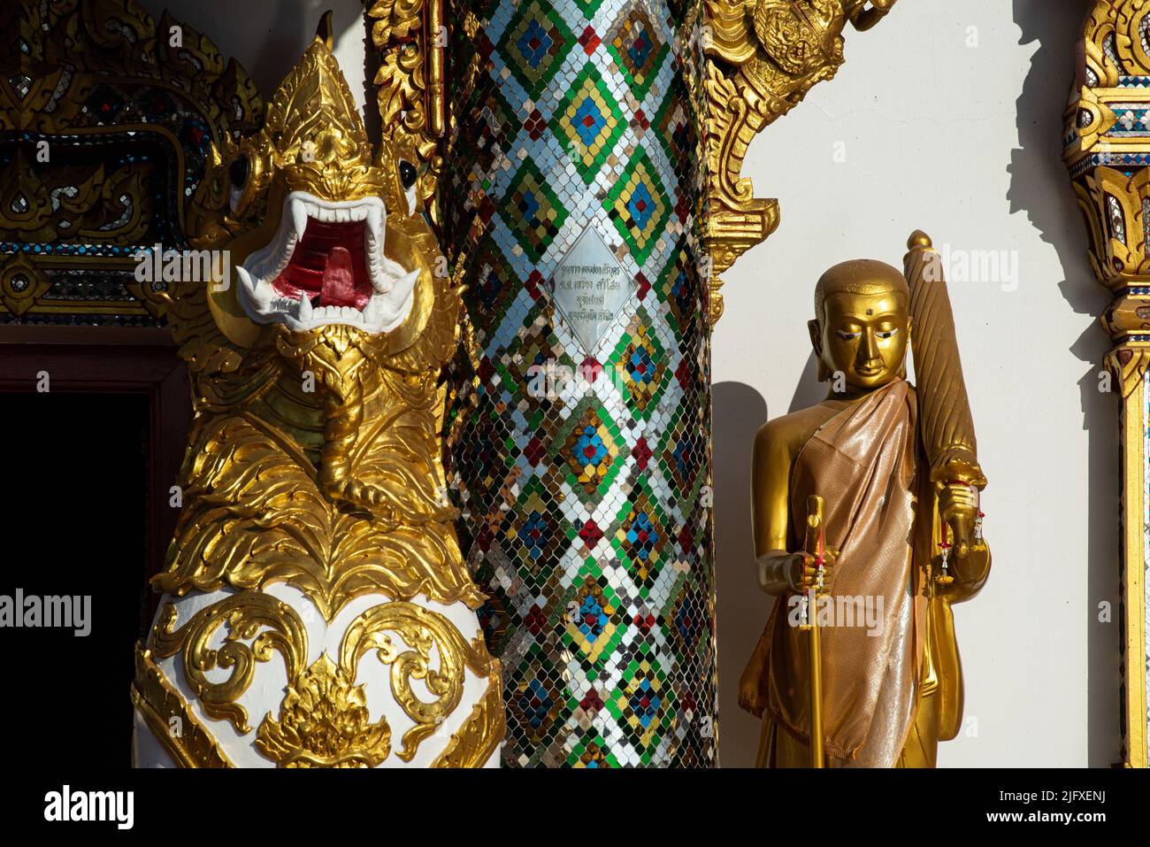 Gold Phra Sivali or Phra Sivalee Buddhist Monk Statue standing front of ...