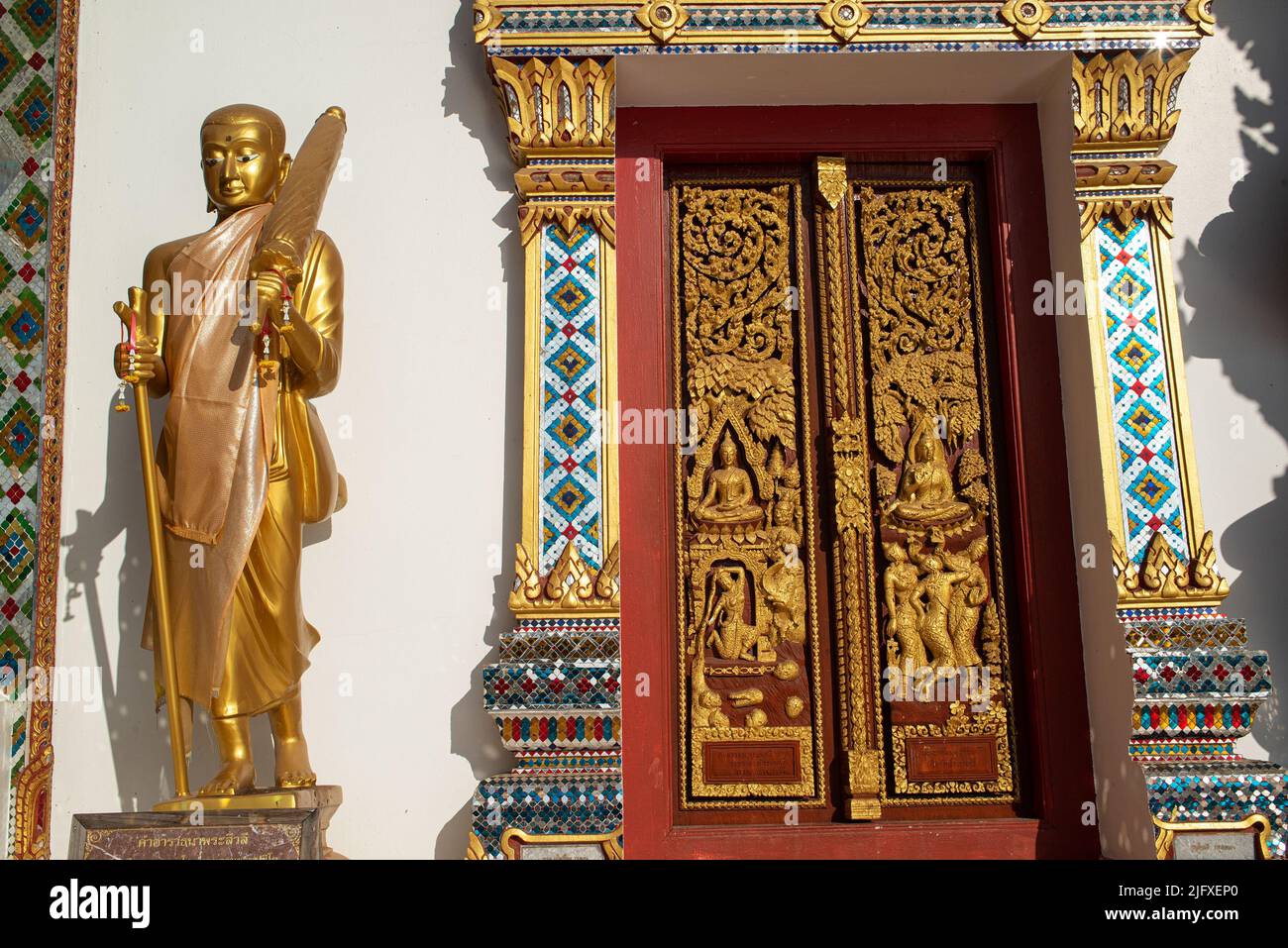 Gold Phra Sivali or Phra Sivalee Buddhist Monk Statue standing front of ...