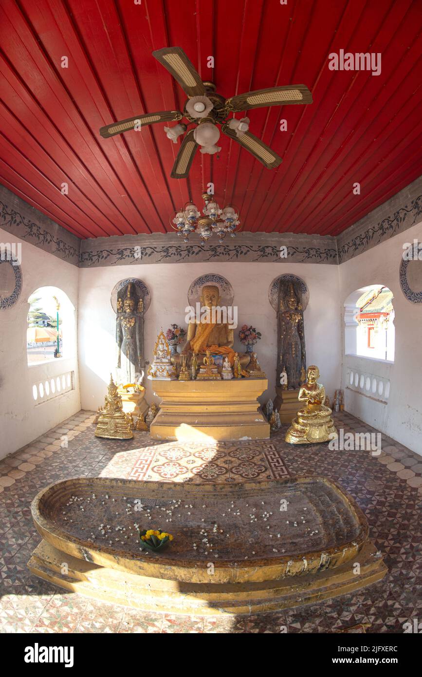 Group of ancient Buddha images, including standing Buddha images ...