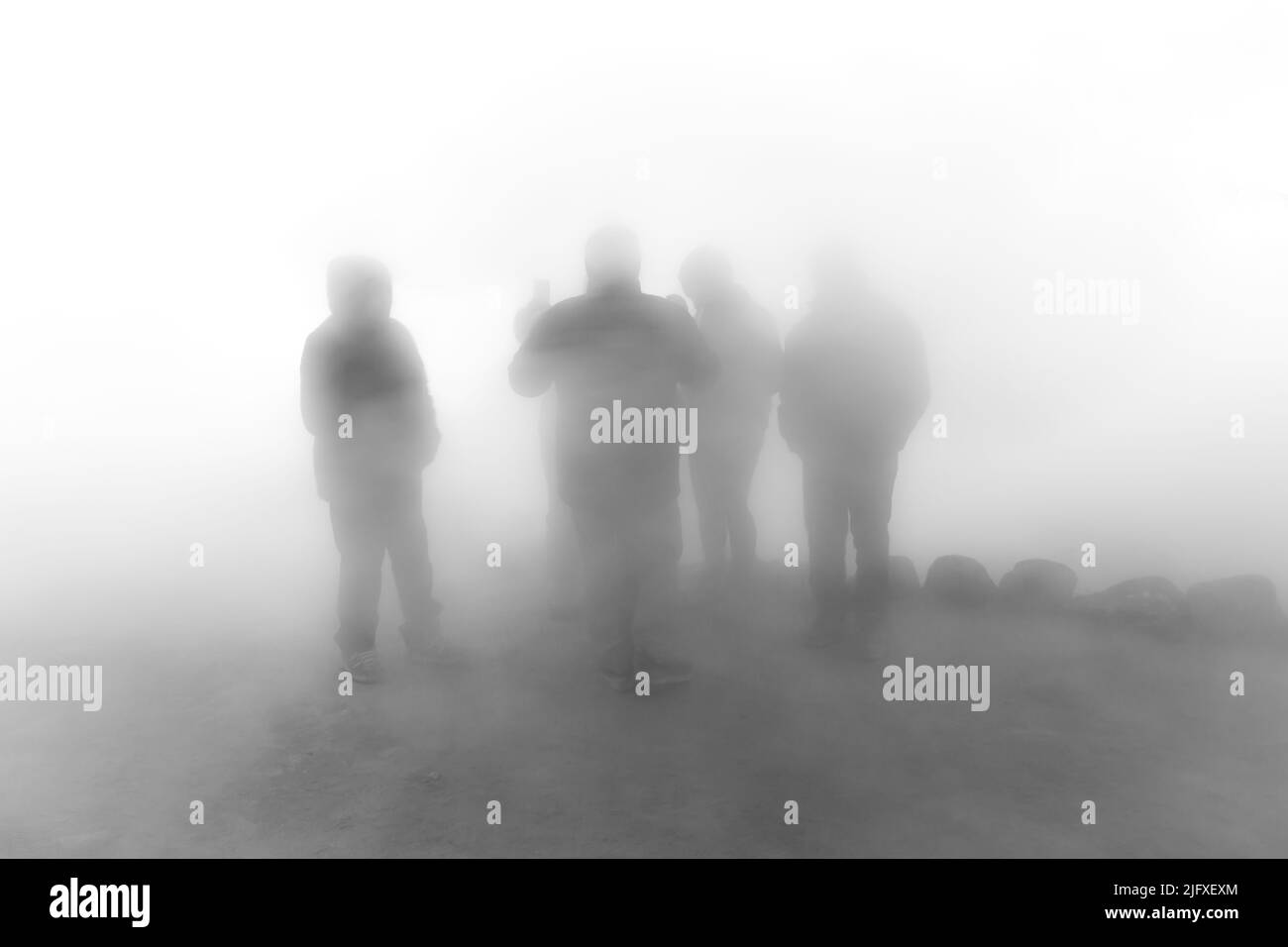 group of people together in heavy fog Stock Photo - Alamy
