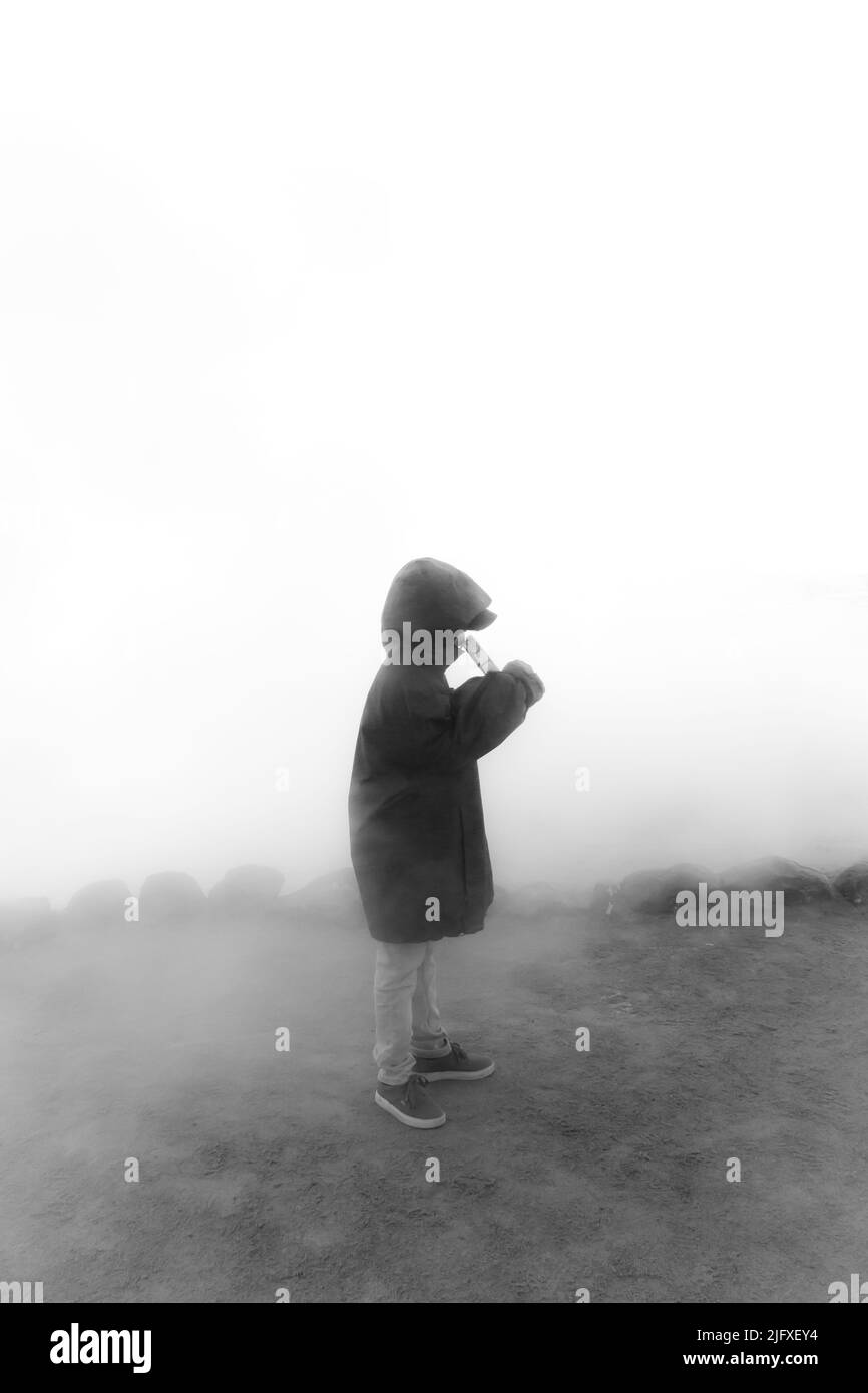 silhouette boy in heavy fog Stock Photo - Alamy