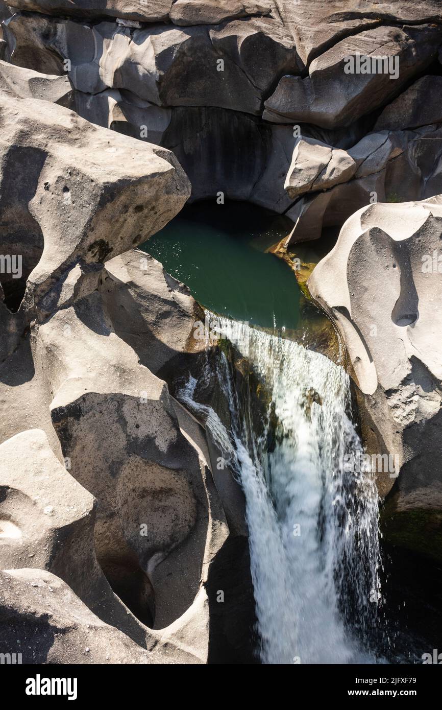 Beautiful view to wild and rocky valley waterfall Stock Photo - Alamy