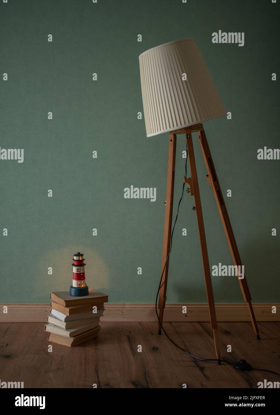A vintage lamp looks down on a lighthouse Stock Photo - Alamy
