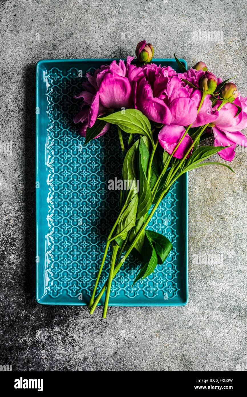 Summer dinner set with peonies Stock Photo - Alamy