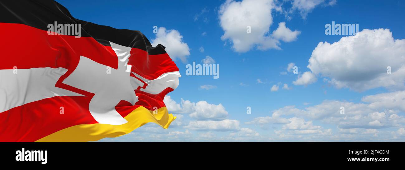 official flag of Austria and Germany, Switzerland Austria at cloudy sky ...