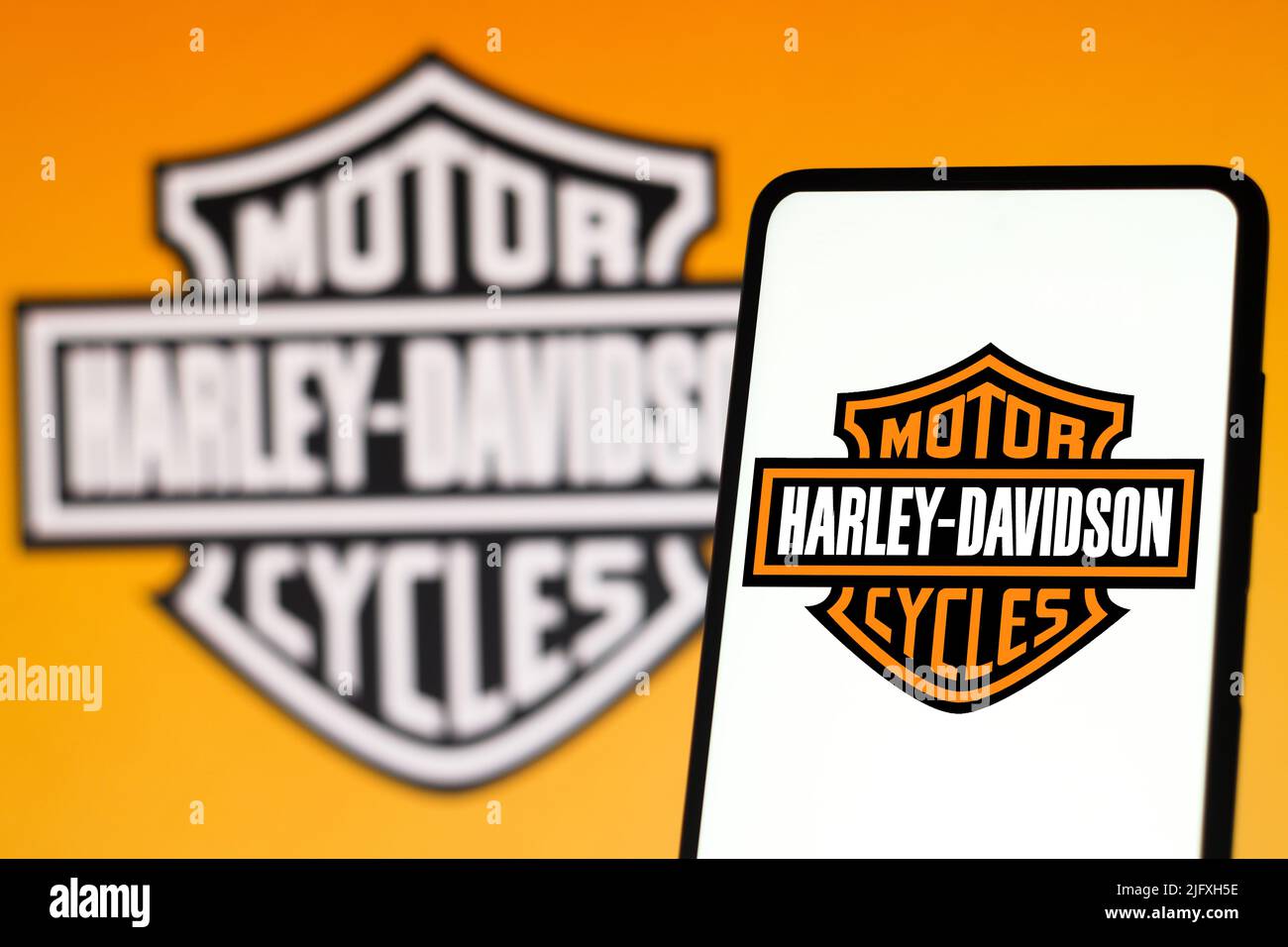 In this photo illustration, the Harley-Davidson Motor Cycles logo is ...