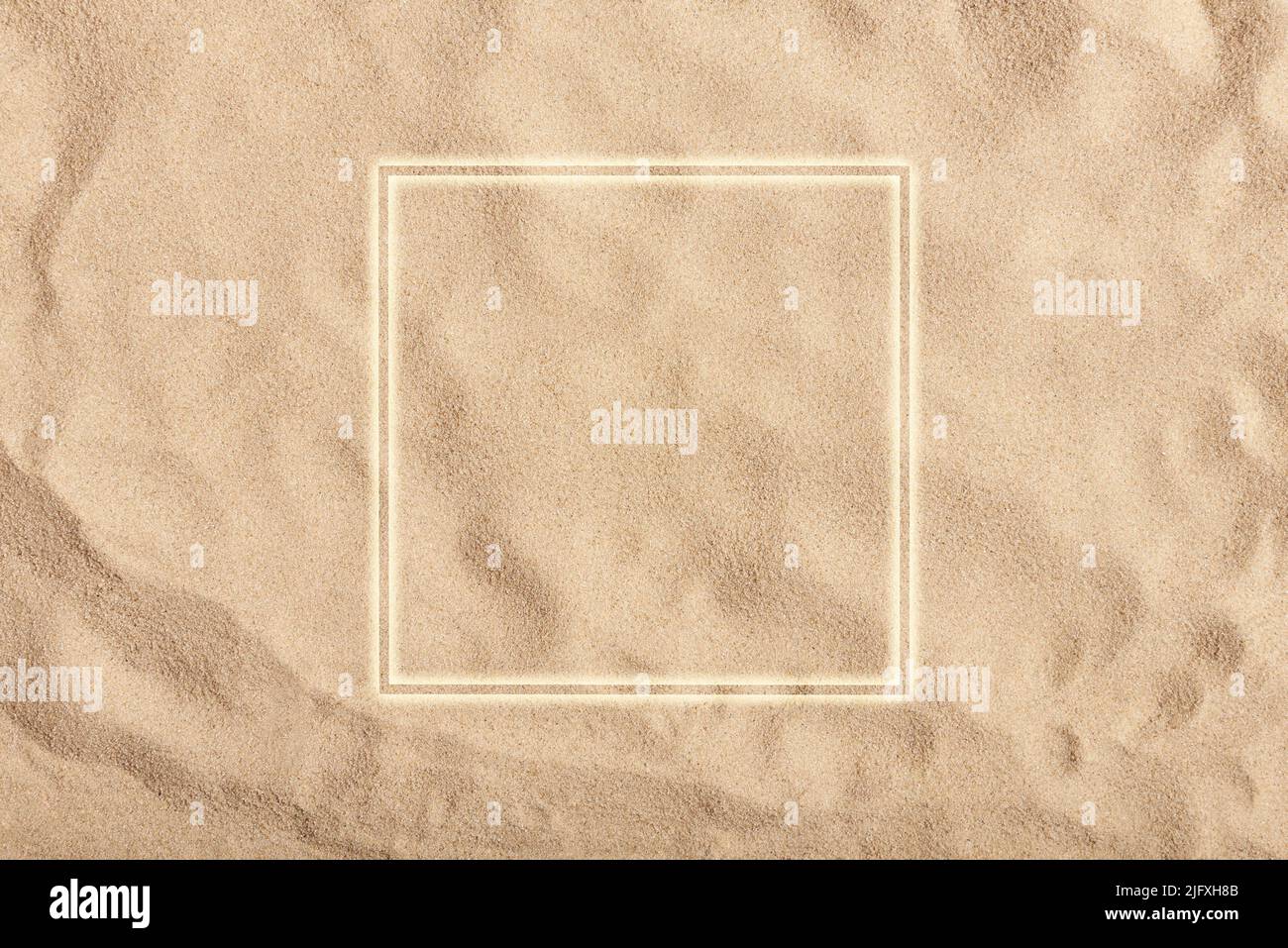 Summer layout, top view of smooth beach sand with an empty trendy light ...