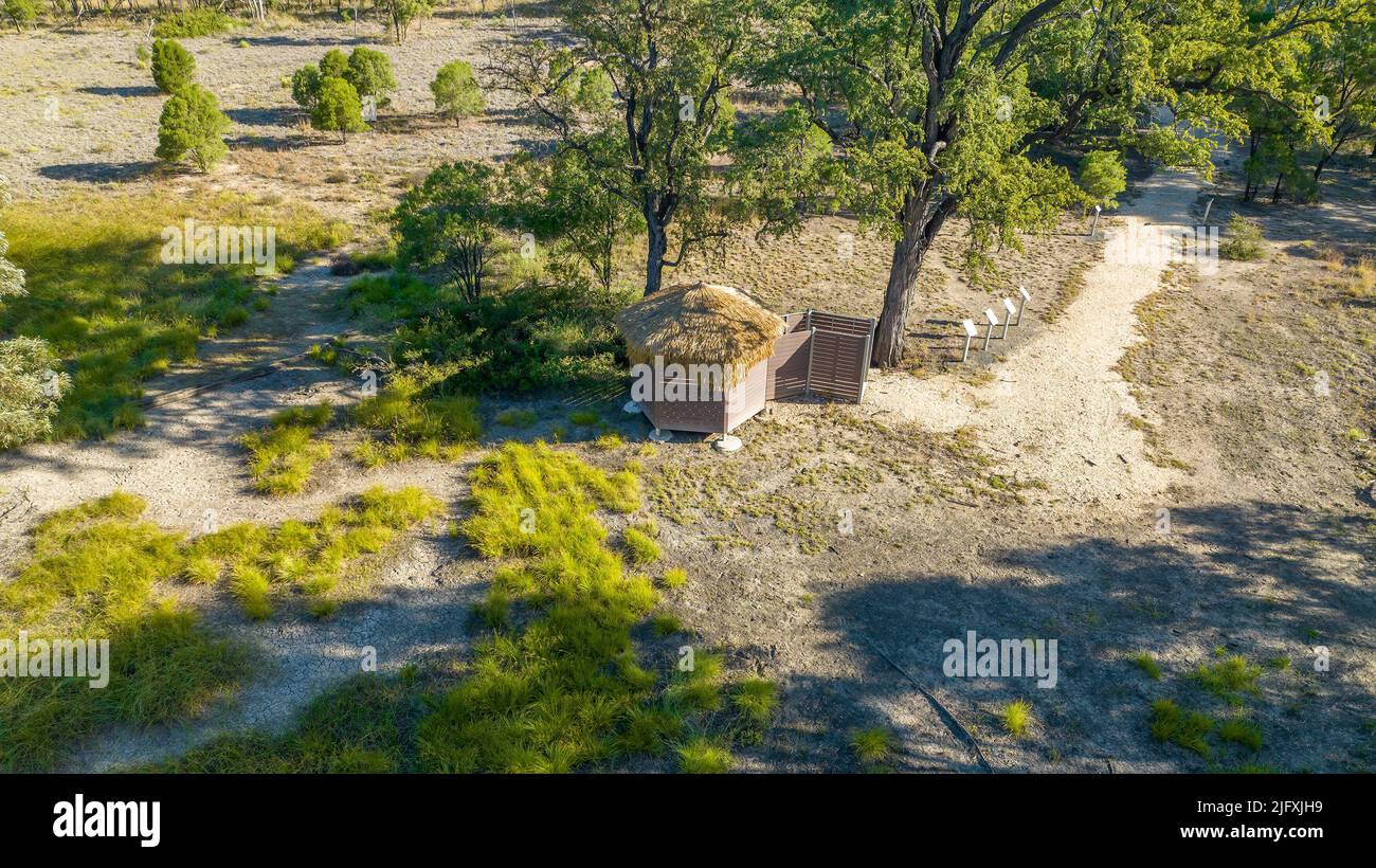 Drone aerial looking down over the bird watching hut and signage along ...