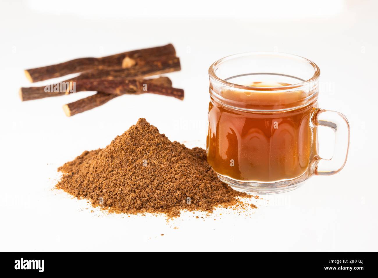 Glycyrrhiza glabra - Licorice roots with hot drink Stock Photo - Alamy