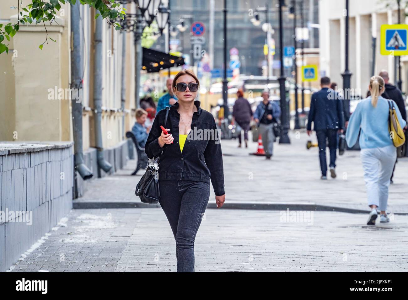 Russia, Moscow. The young girl on one of city streets Stock Photo - Alamy