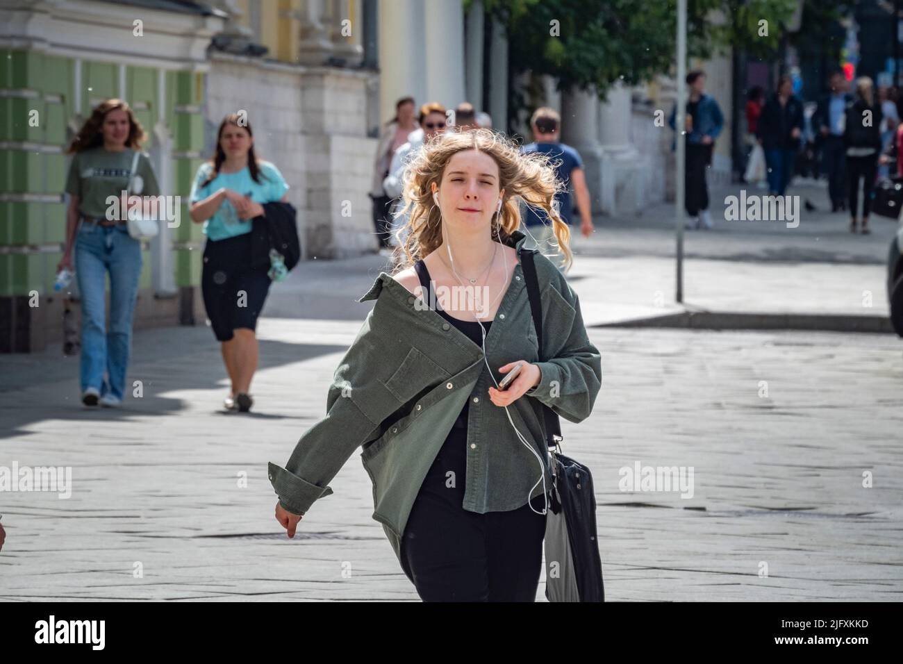 Russia, Moscow. The young girl on one of city streets Stock Photo - Alamy