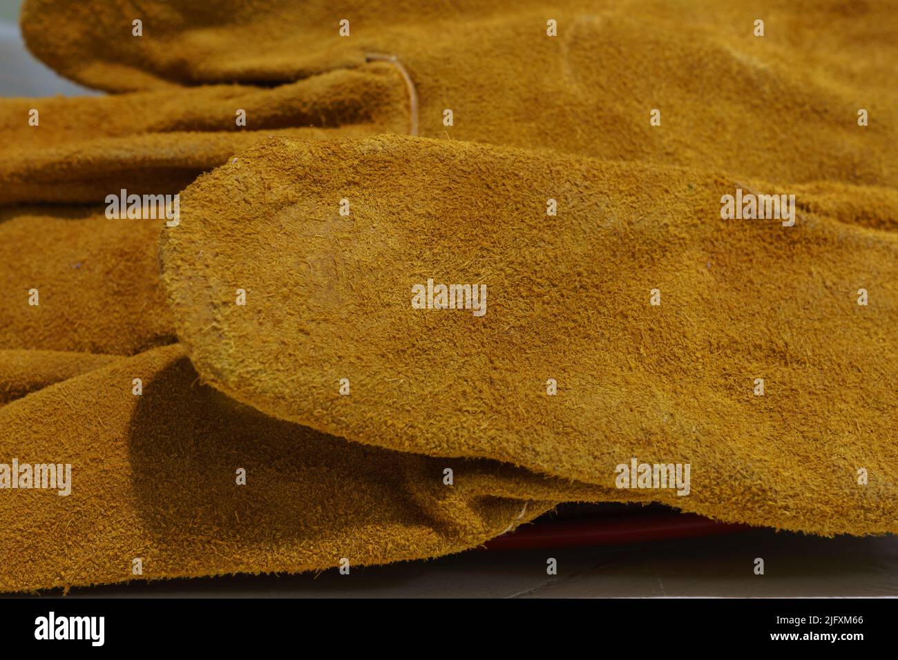 A suede work glove close-up showing the texture of the leather Stock ...