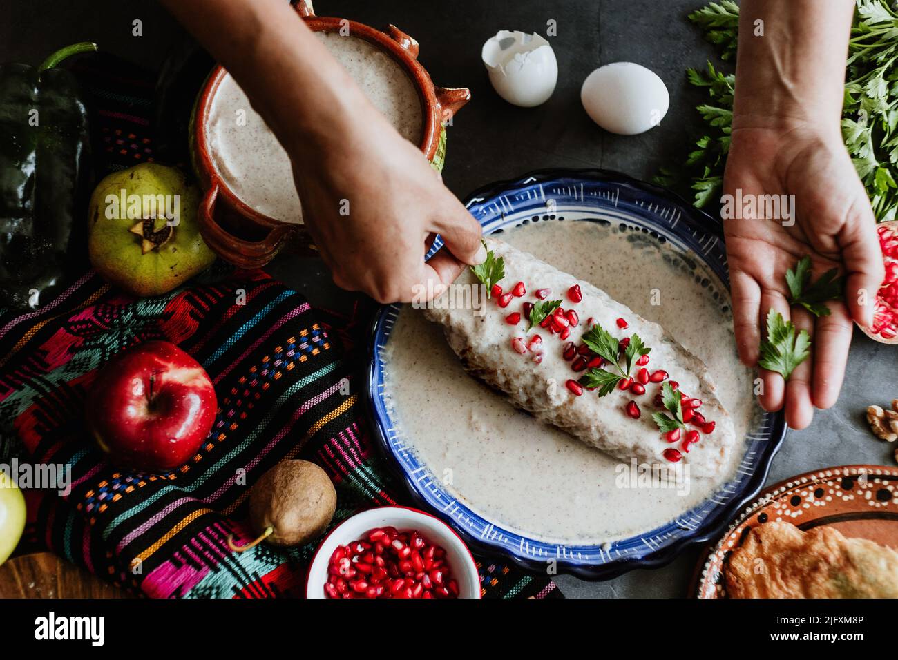 mexican woman cooking chiles en nogada recipe with Poblano chili and ...