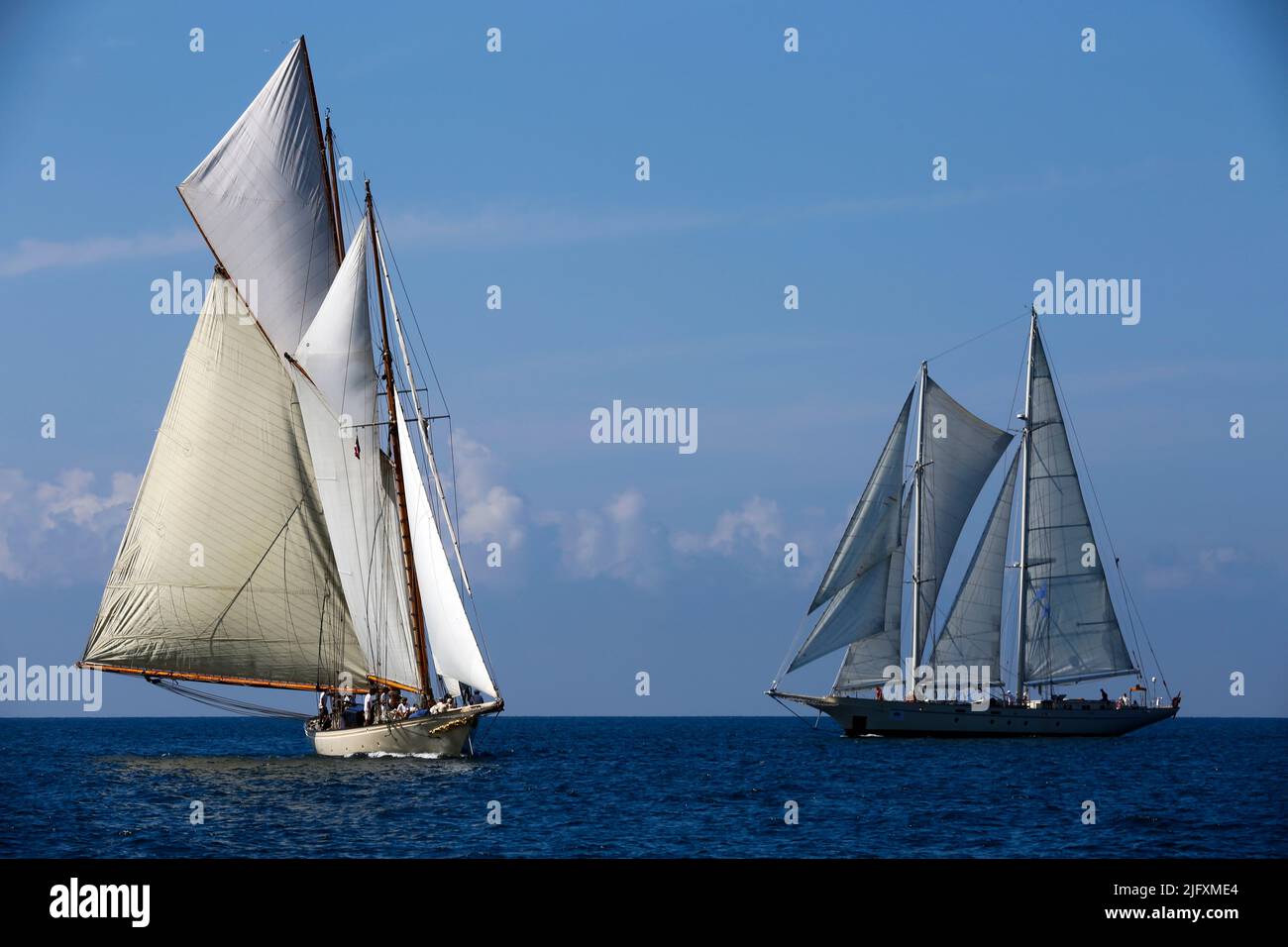 Two schooner sailing ships cruising Stock Photo - Alamy