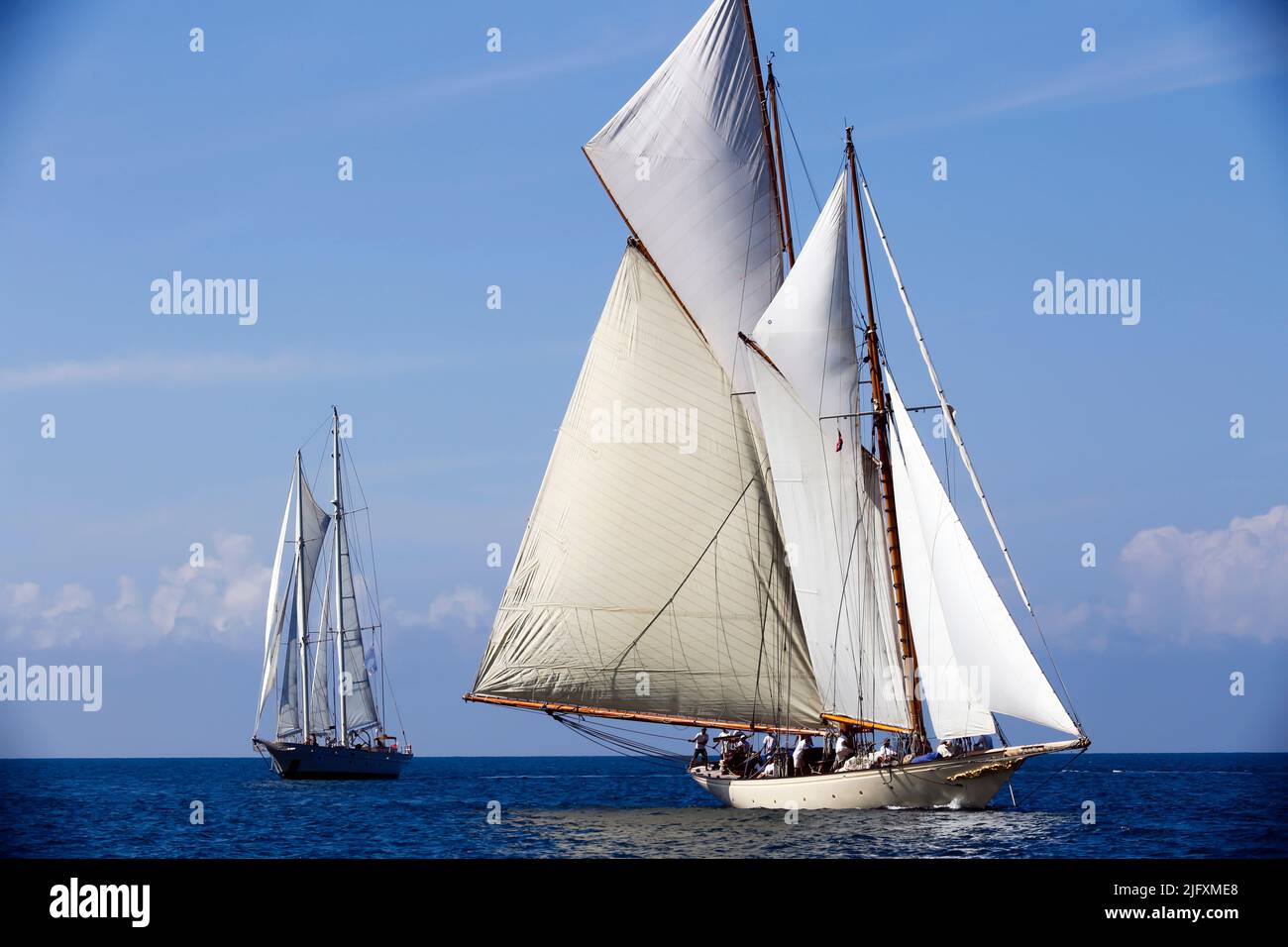 Two schooner sailing ships cruising Stock Photo - Alamy
