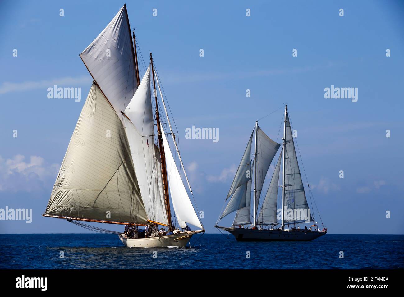 Two schooner sailing ships cruising Stock Photo - Alamy