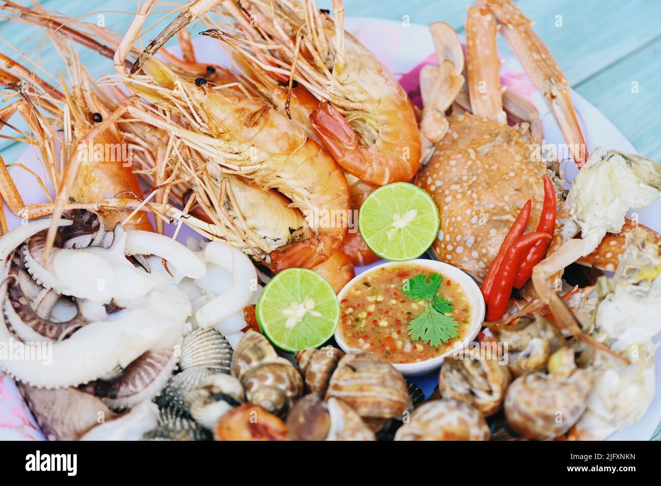 seafood plate with shrimp shellfish crab squid cockle spotted babylon ...