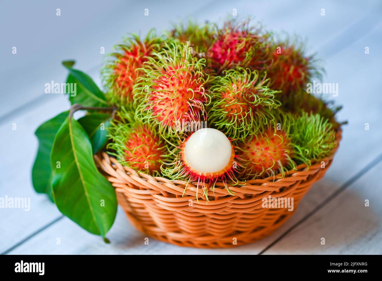 Fresh and ripe rambutan sweet tropical fruit peeled rambutan with leaf ...
