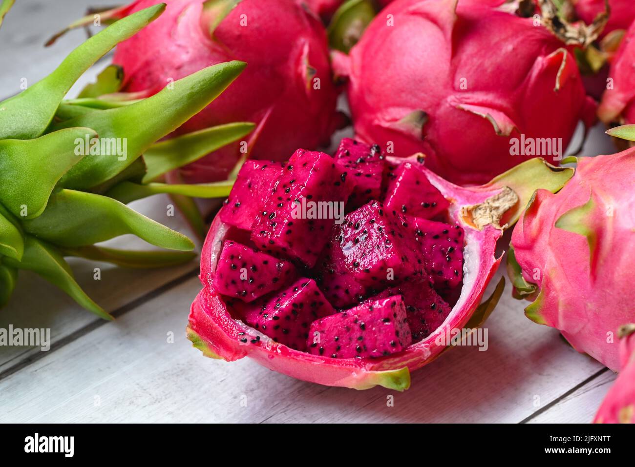 dragon fruit slice on fruit peel with pitahaya background , fresh red ...