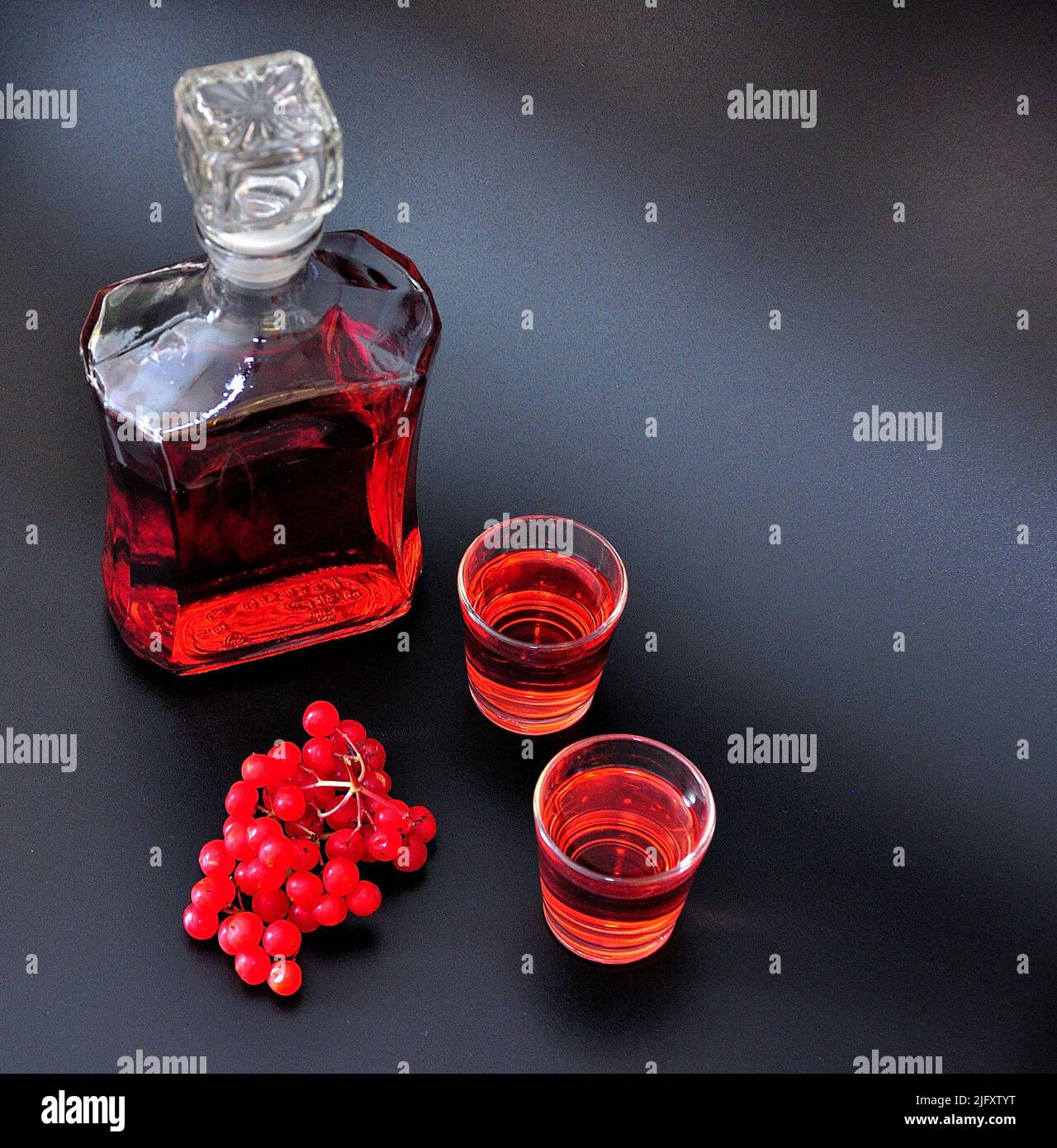 Viburnum liqueur, a sprig of ripe berries and strong homemade alcohol ...