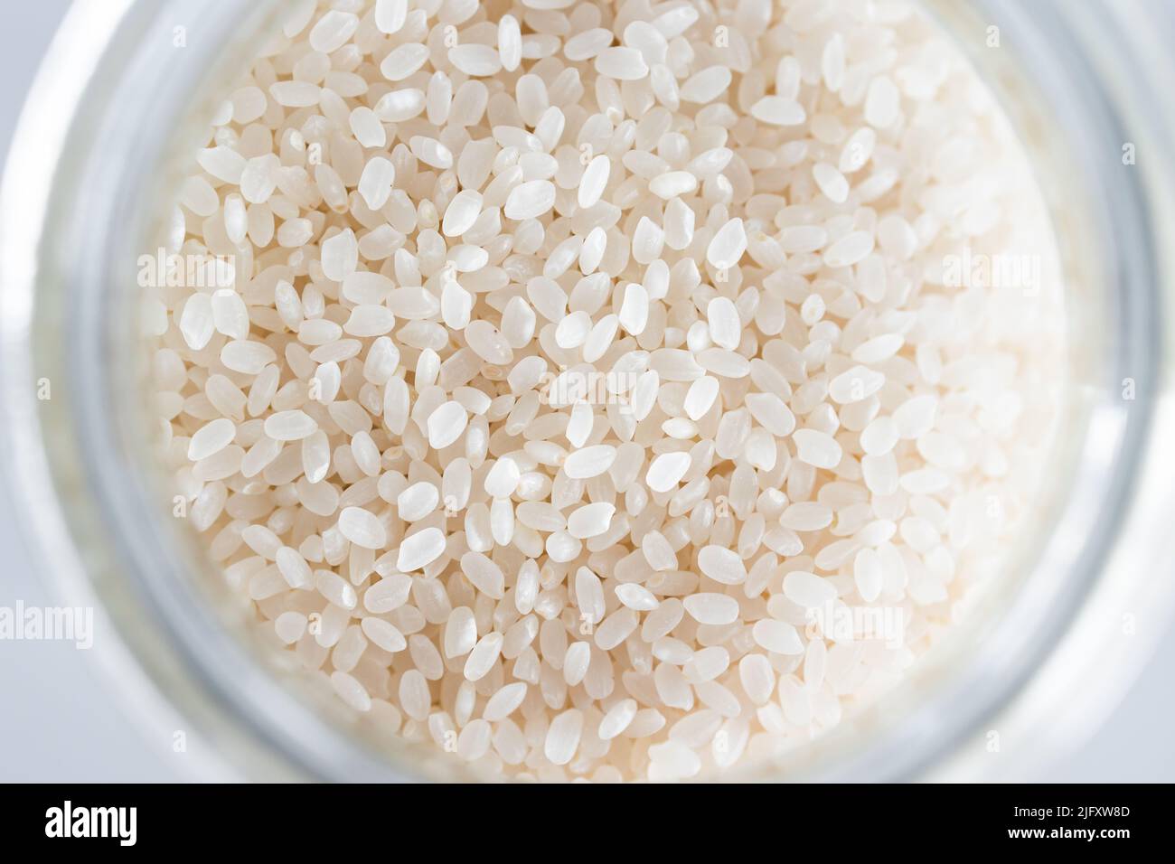 pantry jar with sushi rice shot from top down perspective as close-up ...