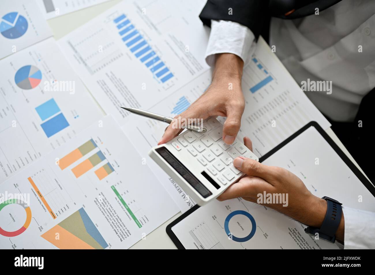 Overhead view, A businessman or male financial worker using a ...