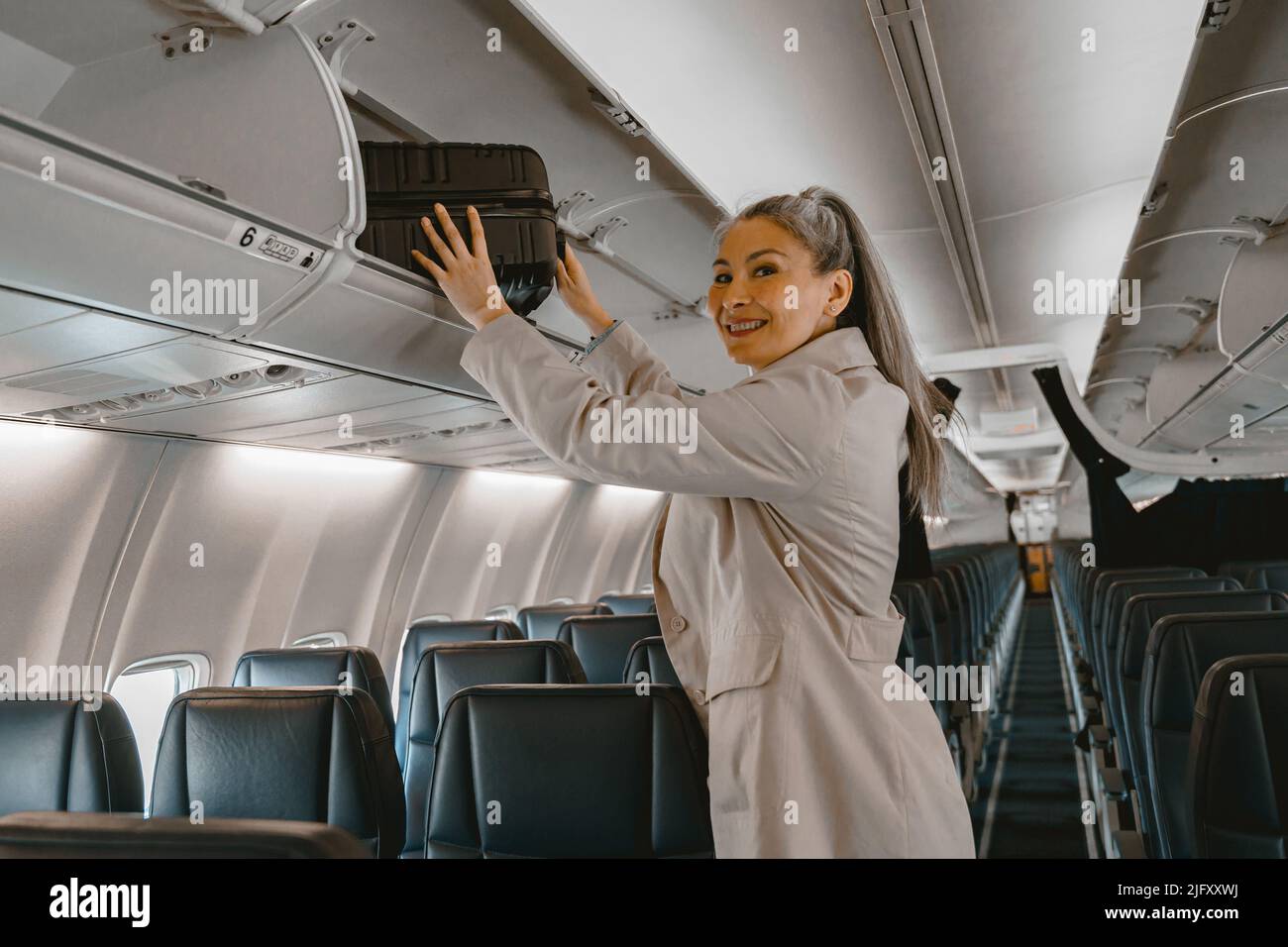 Young air hostess luggage bag hi-res stock photography and images - Alamy