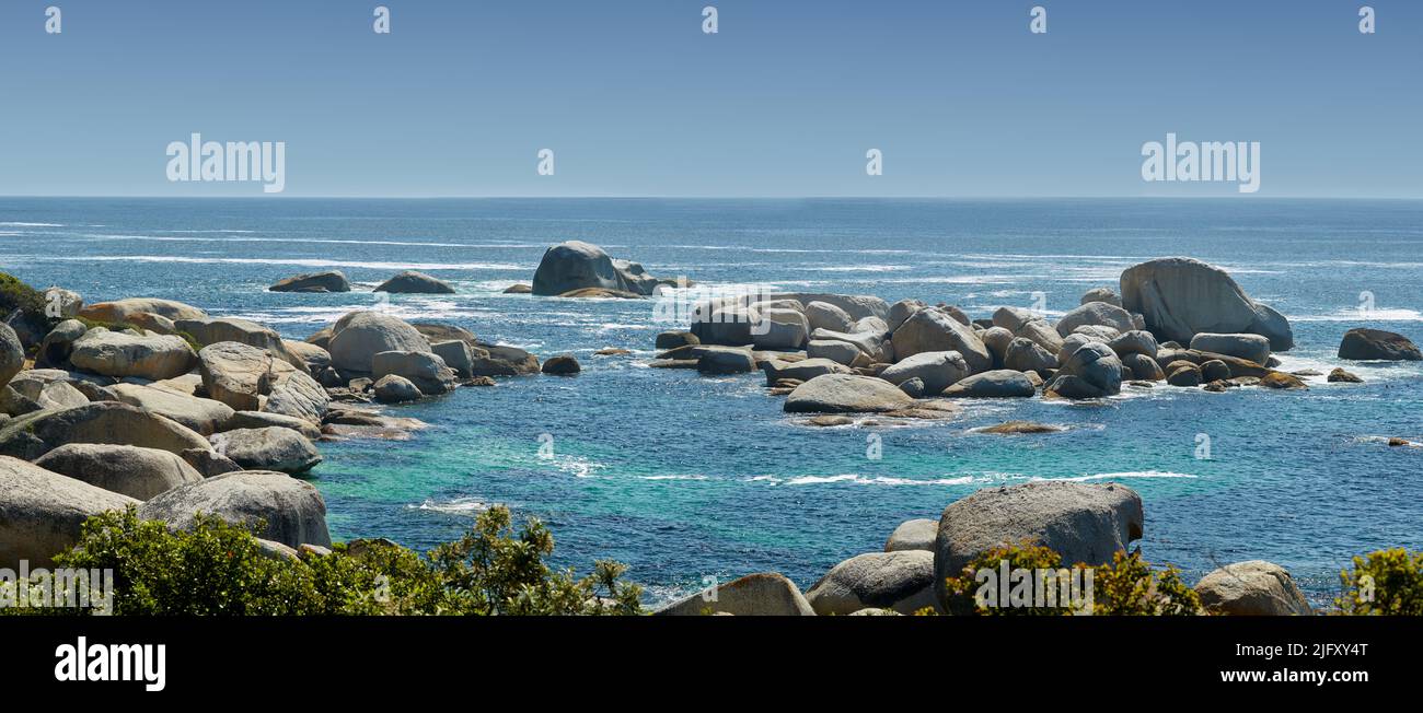 Landscape of large rocks in the ocean in summer. Many stones by the ...