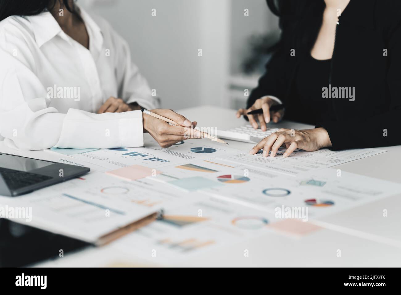 Group of Business woman and Accountant checking data document for ...