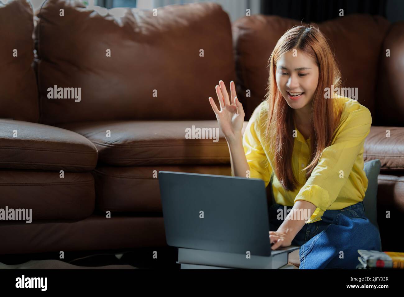 Young asian girl student watching online class by laptop. e-learning ...