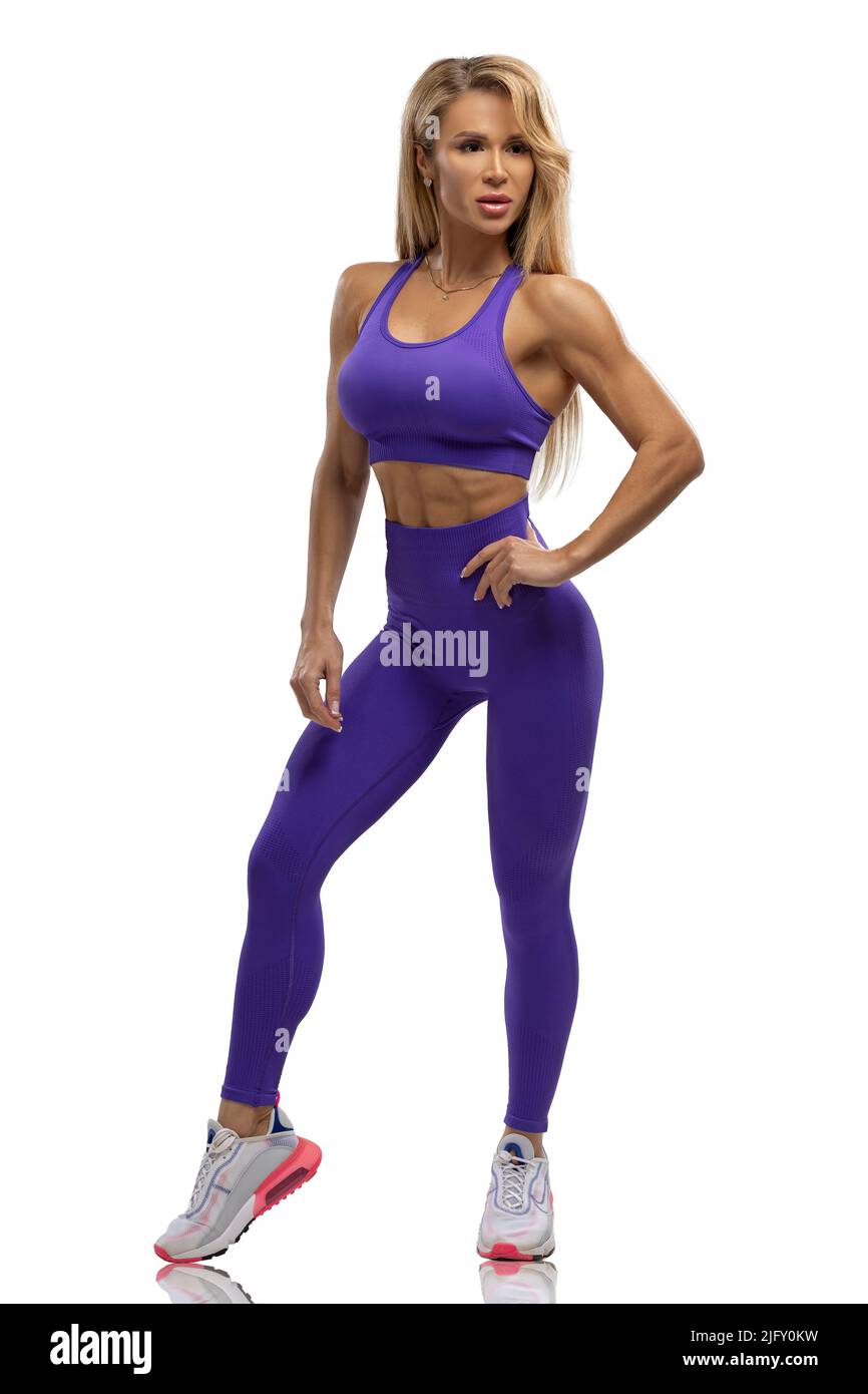 Blonde Fit Girl In Blue Leggings And Top On A White Background In The